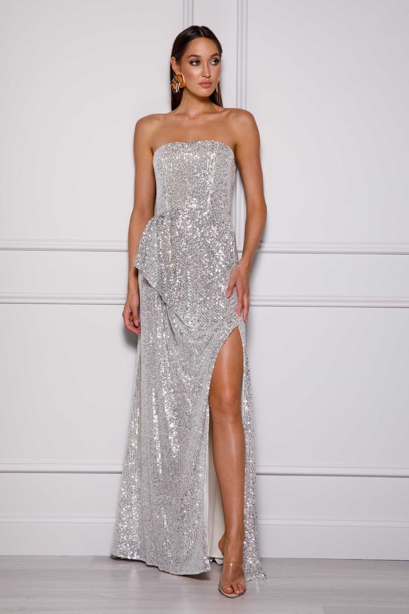 Strapless features inner bodice boning and peplum detail